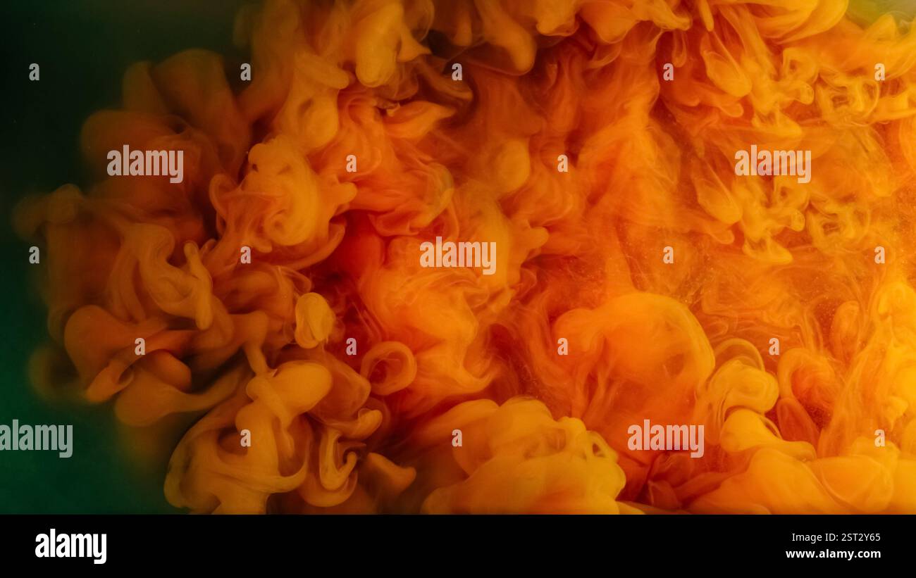 Ink water explosion. Smoke ethereal. Defocused orange haze fume mist ...