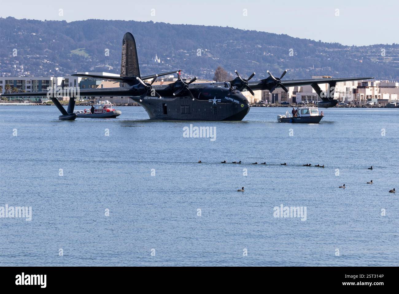 The Phillippine Mars is towed out of the seaplane lagoon at the former ...