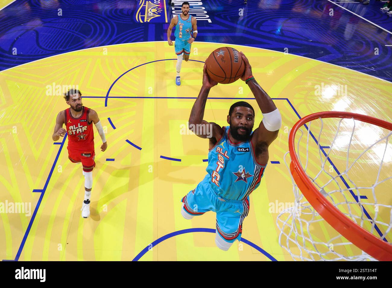 Dallas Mavericks guard Kyrie Irving, center, dunks next to Atlanta ...