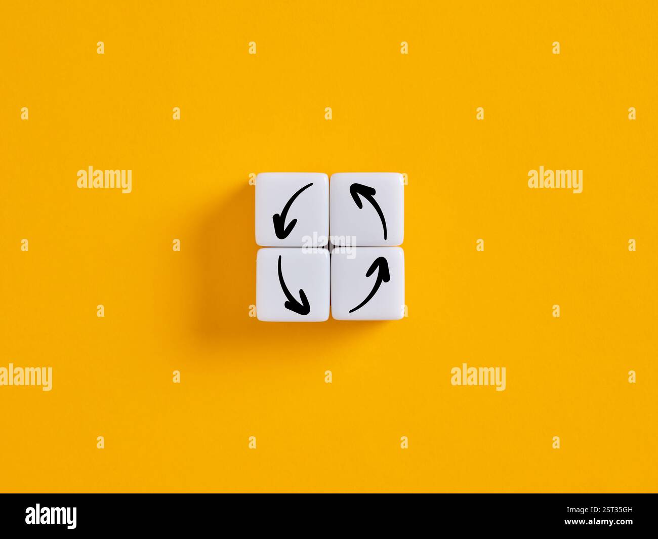 Four white dice are showing black arrows forming a circle, illustrating ...