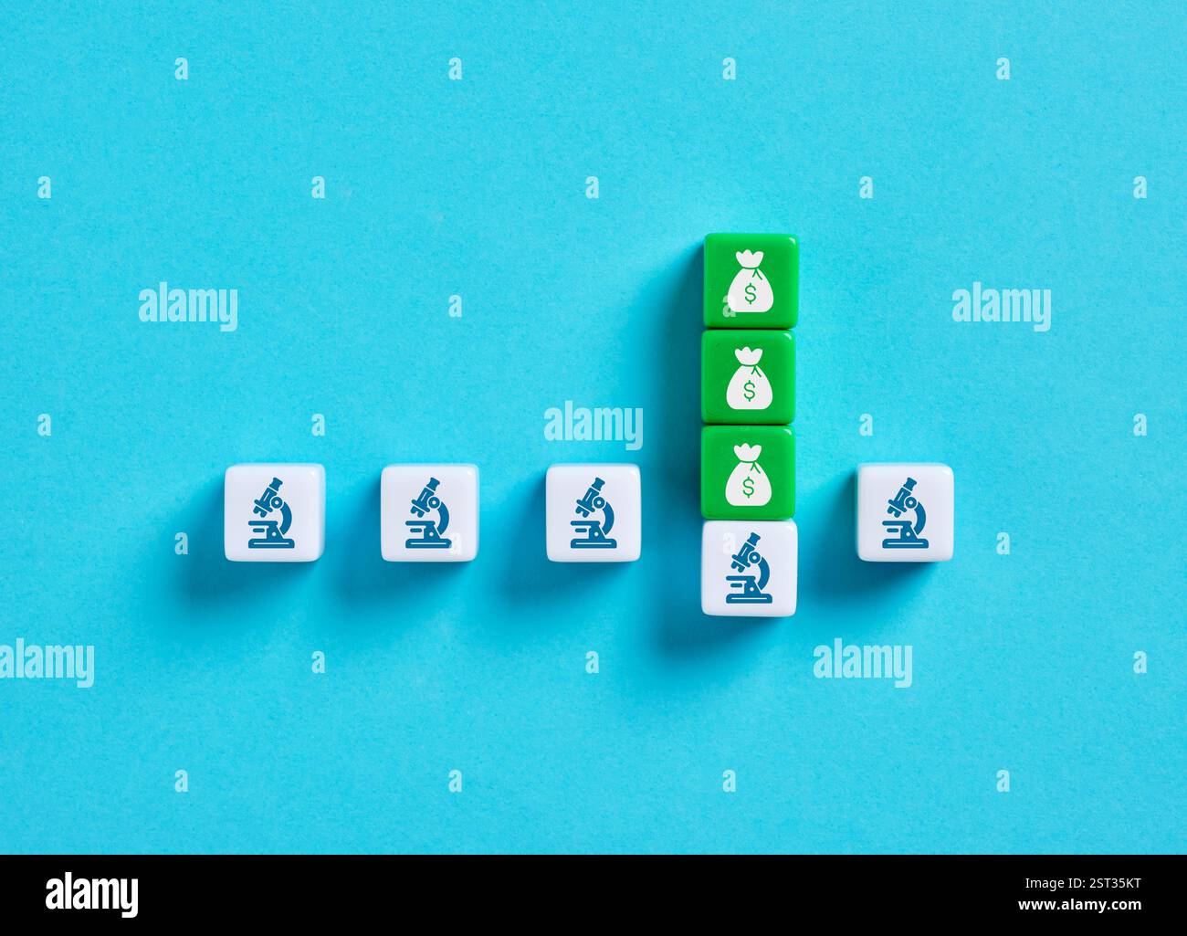 Science research funding concept with microscopes and money bags on ...