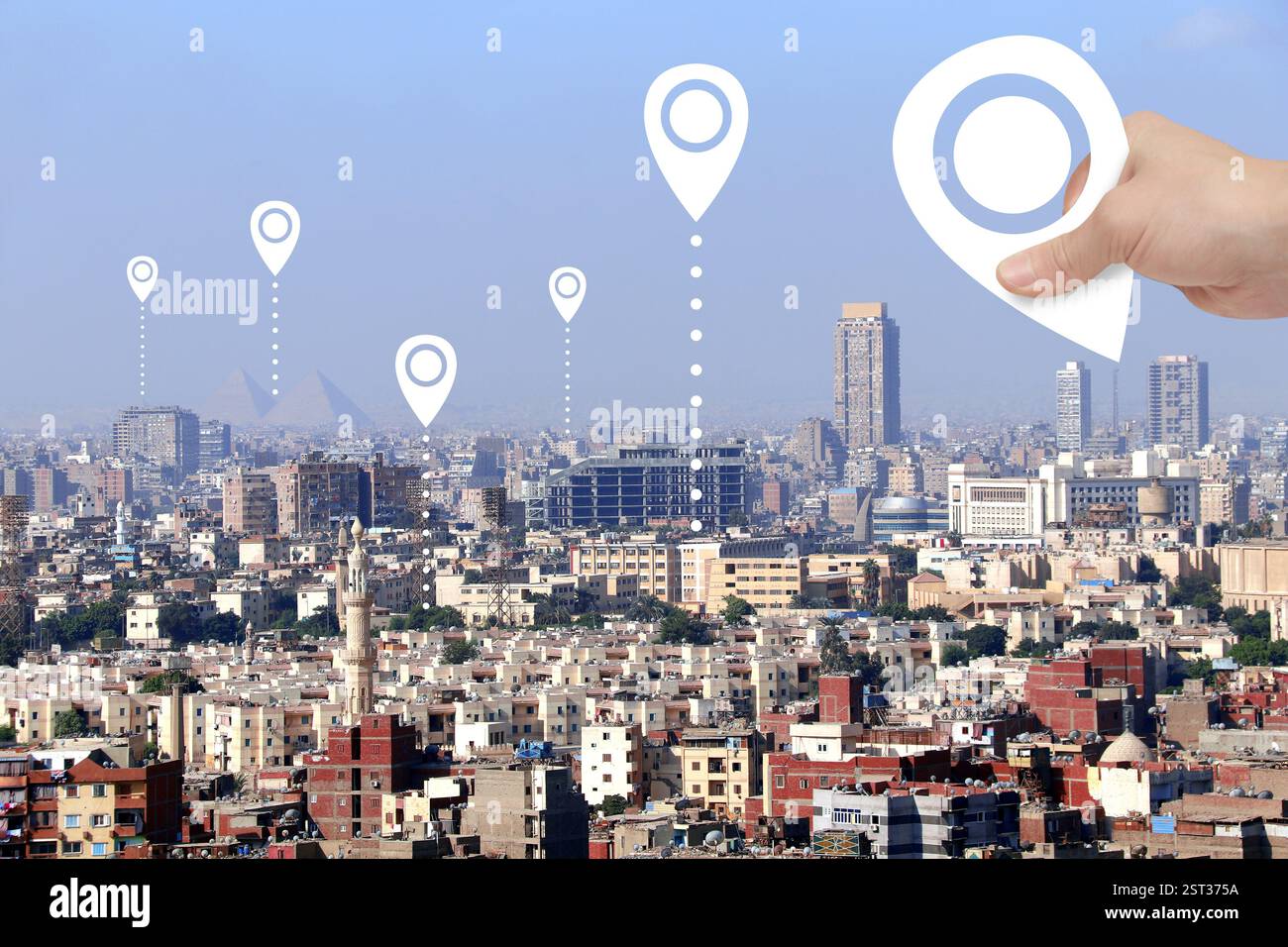 Planning a tourist trip. Top view of Cairo with Great Pyramids and hand ...