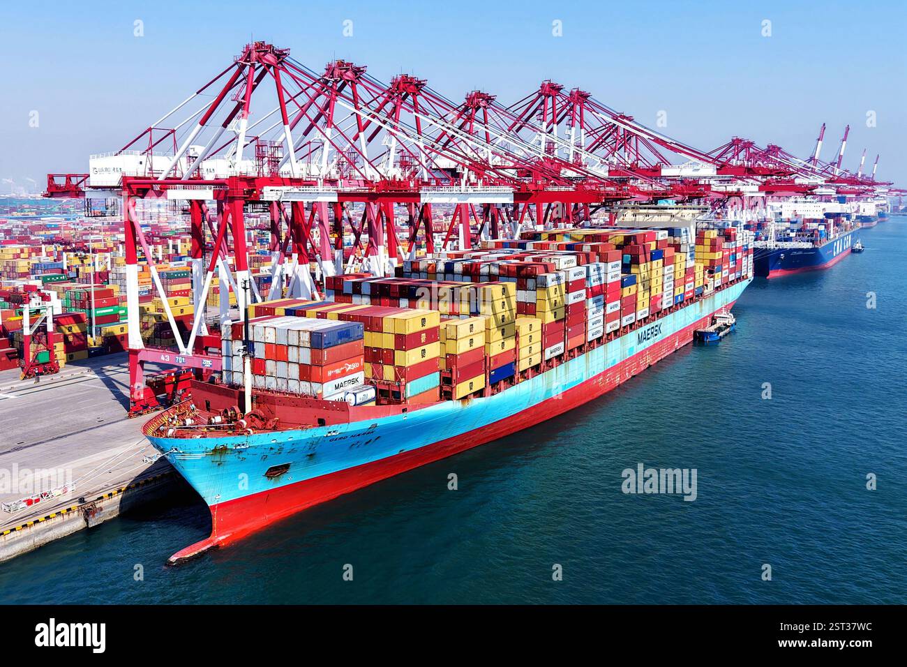 QINGDAO, CHINA - FEBRUARY 17, 2025 - Cargo ships load and unload ...