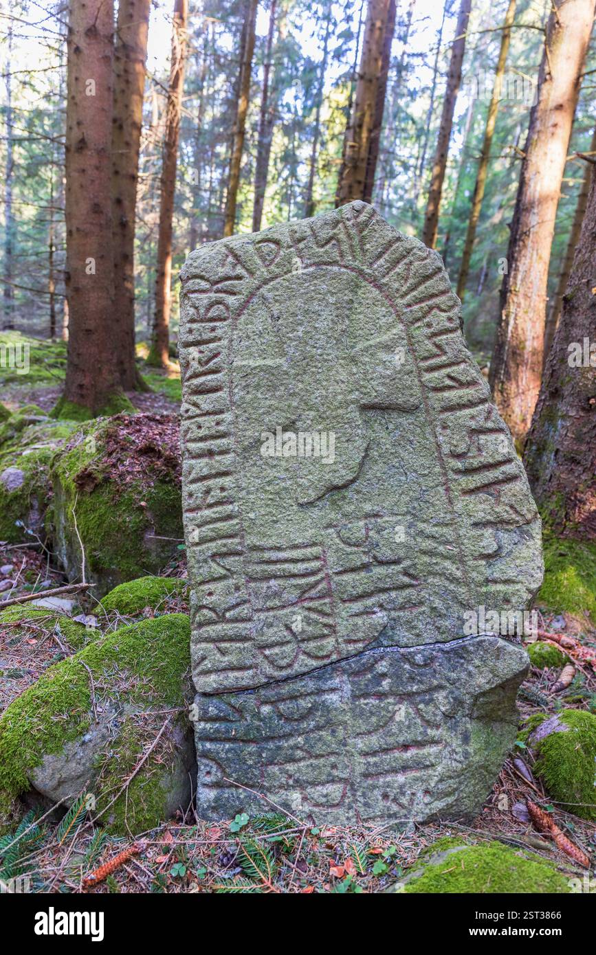 Runestone with runes and a cross Stock Photo - Alamy
