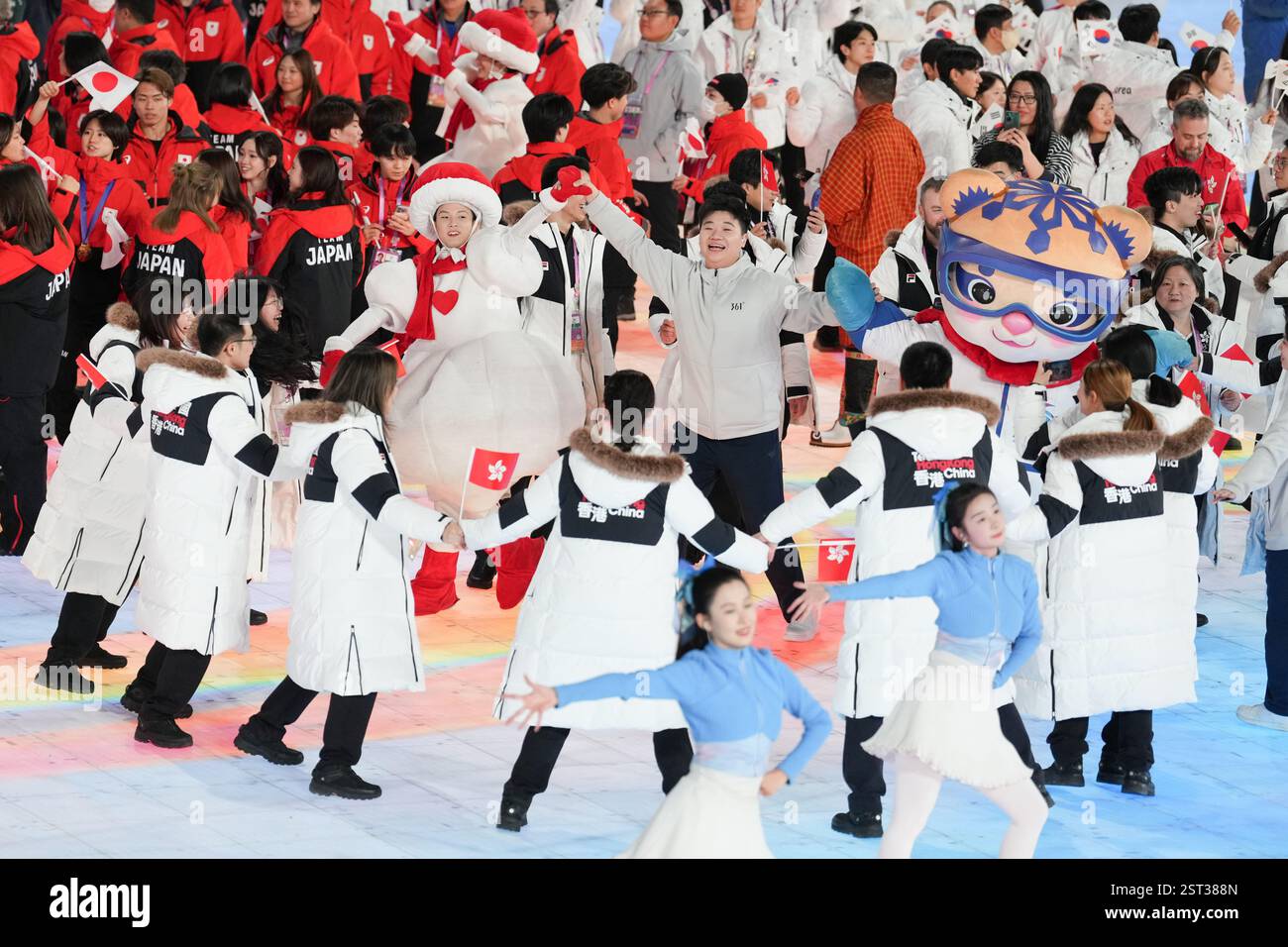 Harbin,China.14th February 2025. Athletes interact during the closing ...