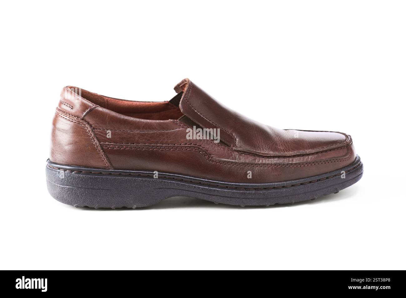 Side view of a single brown leather shoe isolated on white background ...