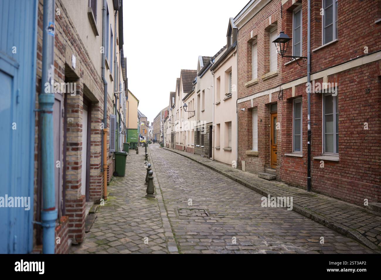 Charming cobblestone street in Amiens, France, lined with brick and ...