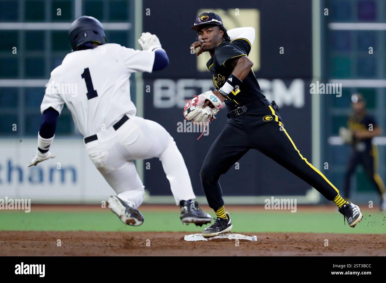 Grambling State shortstop Nyan Hayes, right, turns a double play as ...