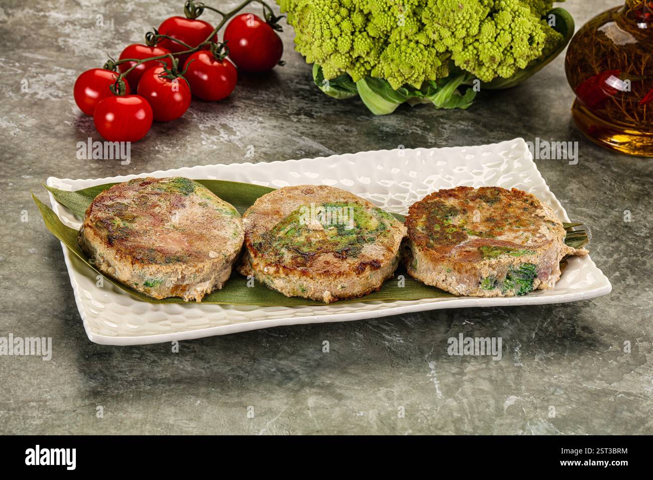 Roasted tuna medallion with broccoli cabbage Stock Photo - Alamy