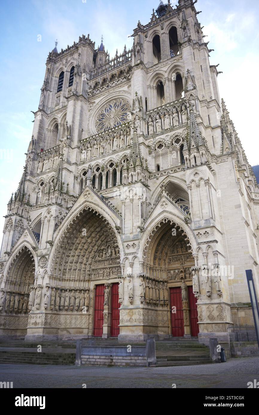 Majestic facade of a Gothic cathedral showcasing intricate sculptures ...