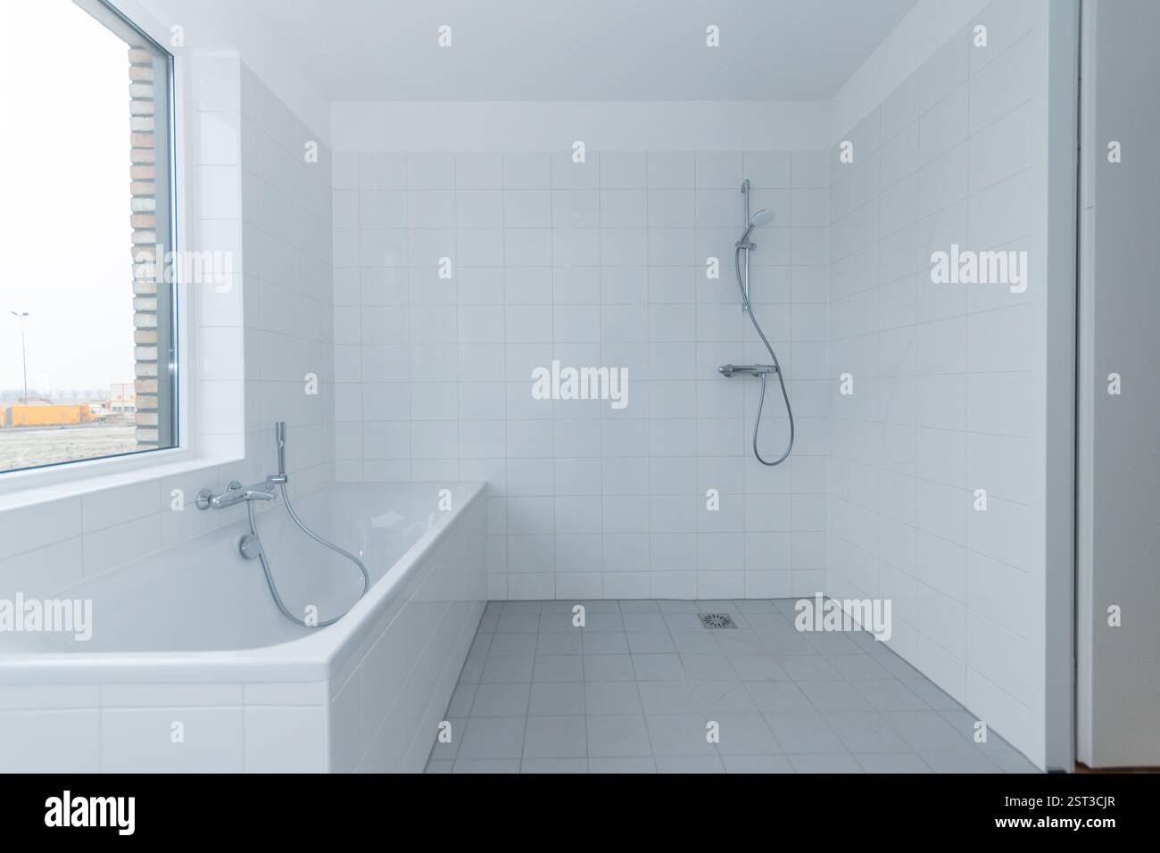 interior clean white tiled bath, shower and bathroom of modern new ...