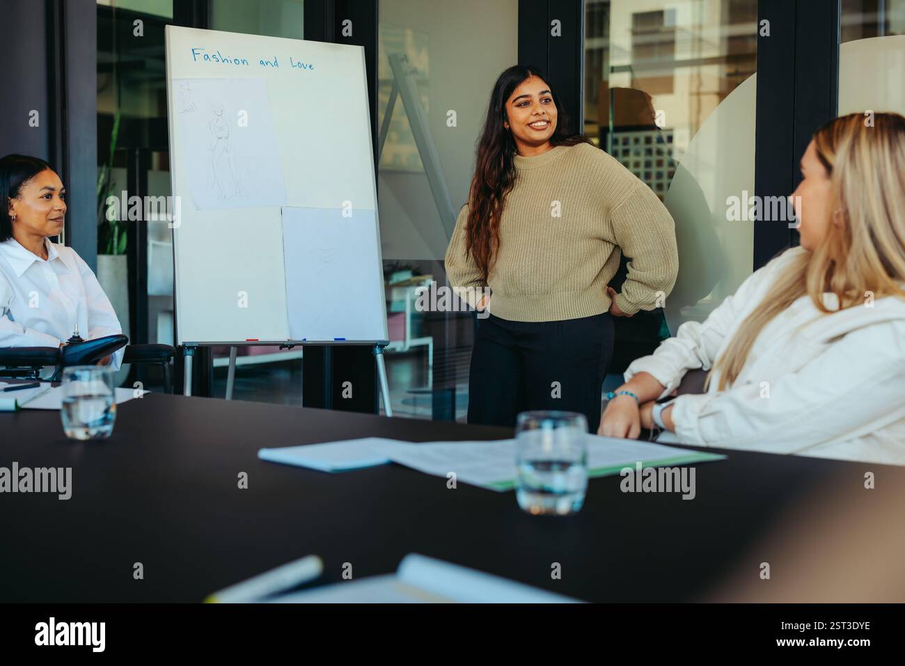 A female university post-graduate student engages her peers with a creative fashion presentation ...