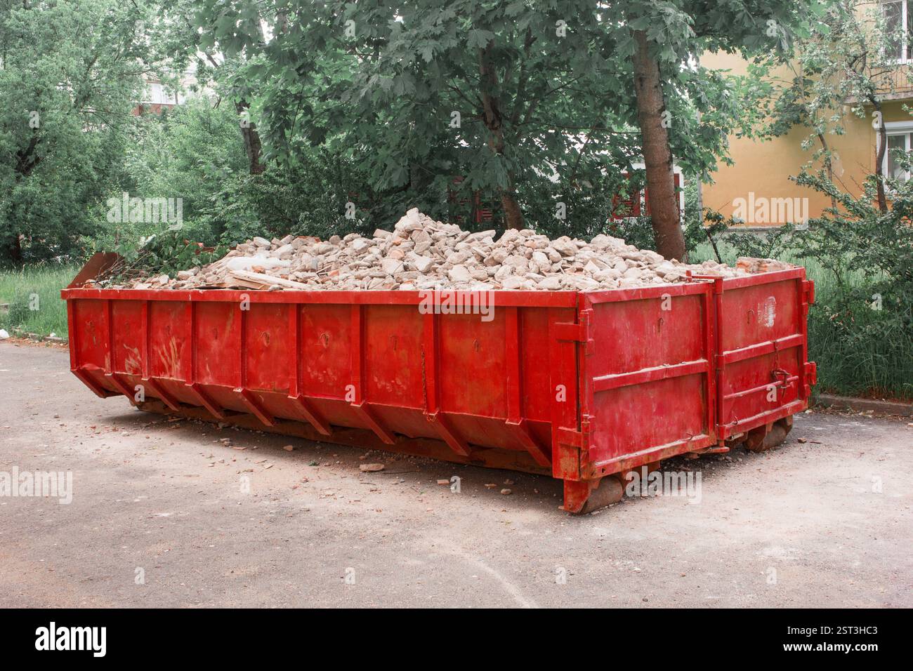 Red container with solid domestic and construction waste Stock Photo ...