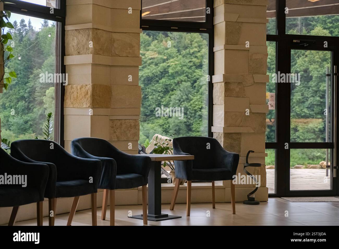 Modern hotel lobby with panoramic windows and nature view Stock Photo ...