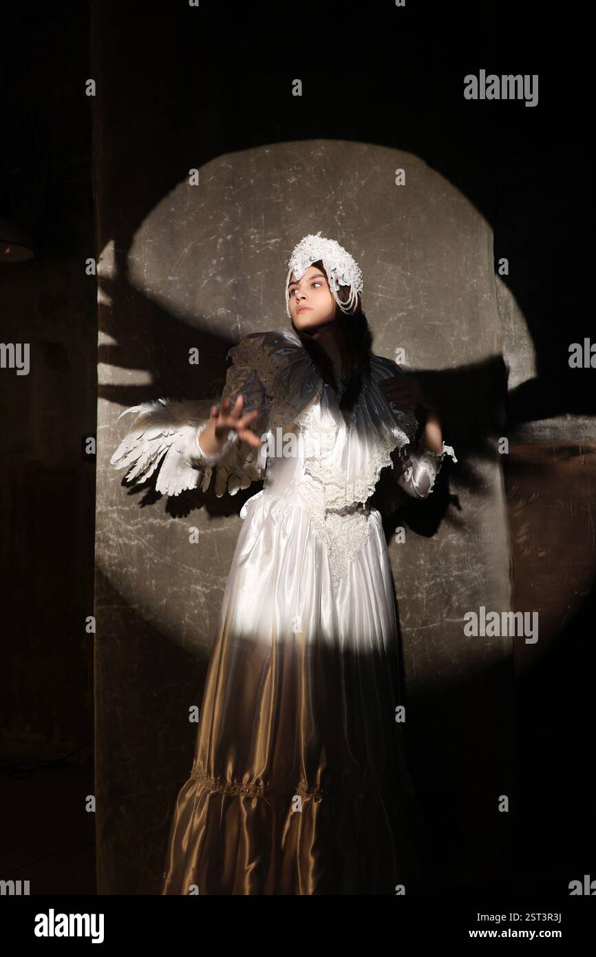 A figure in a vintage white satin gown with intricate lace details and ...