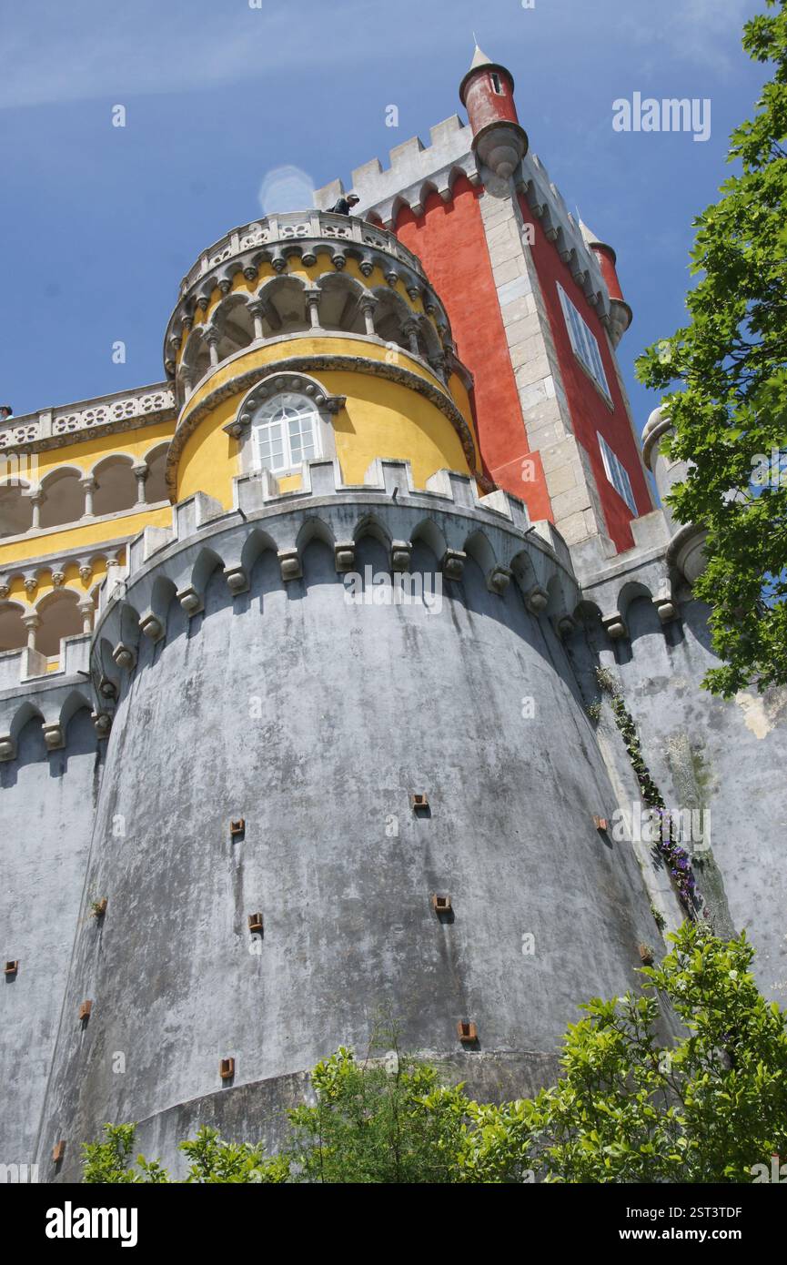 Pena Palace, Sintra. Vibrant facade, yellow, red, grey tones ...
