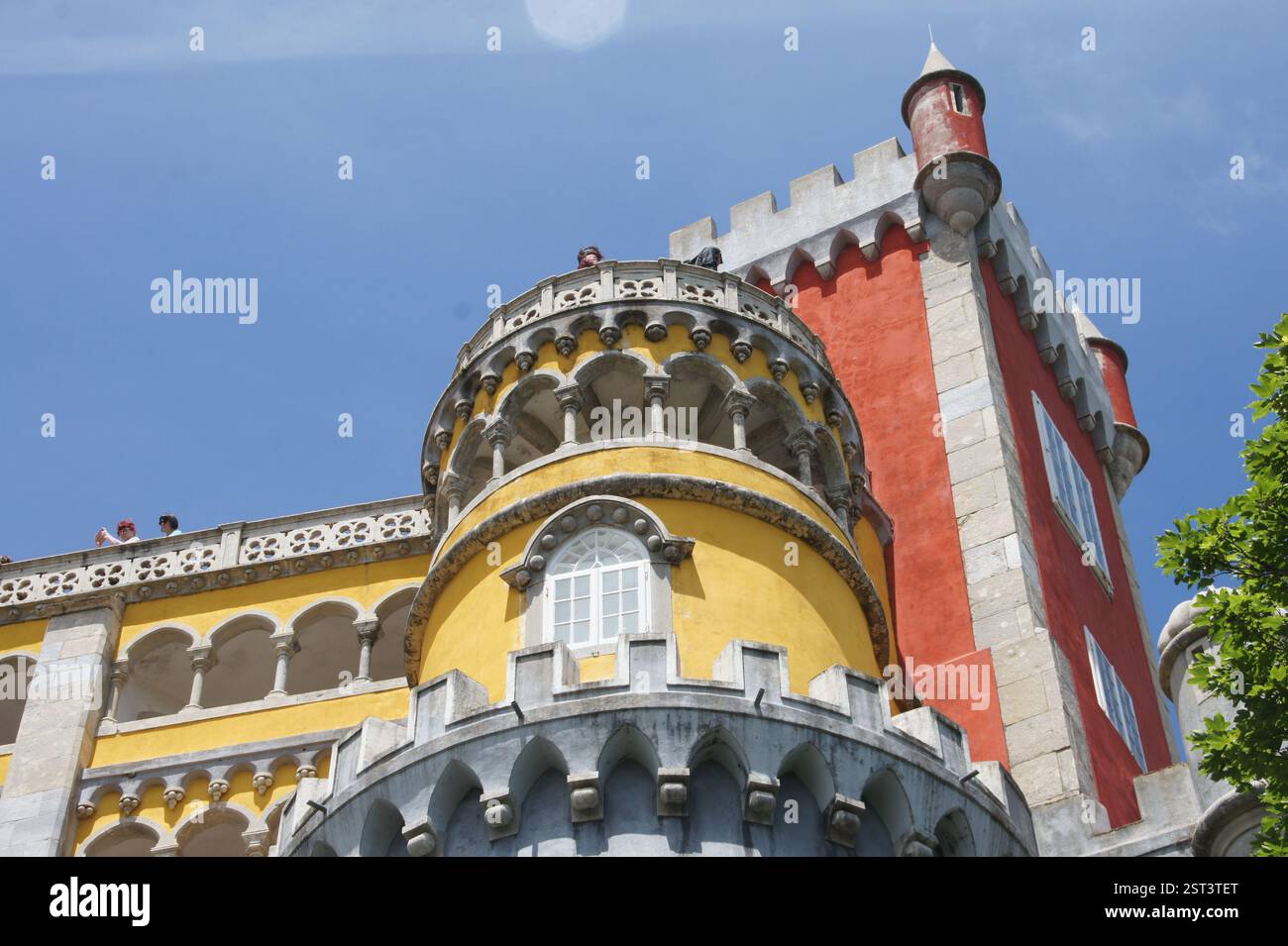 Pena Palace, Sintra, Portugal. A vibrant facade showcases red, yellow ...