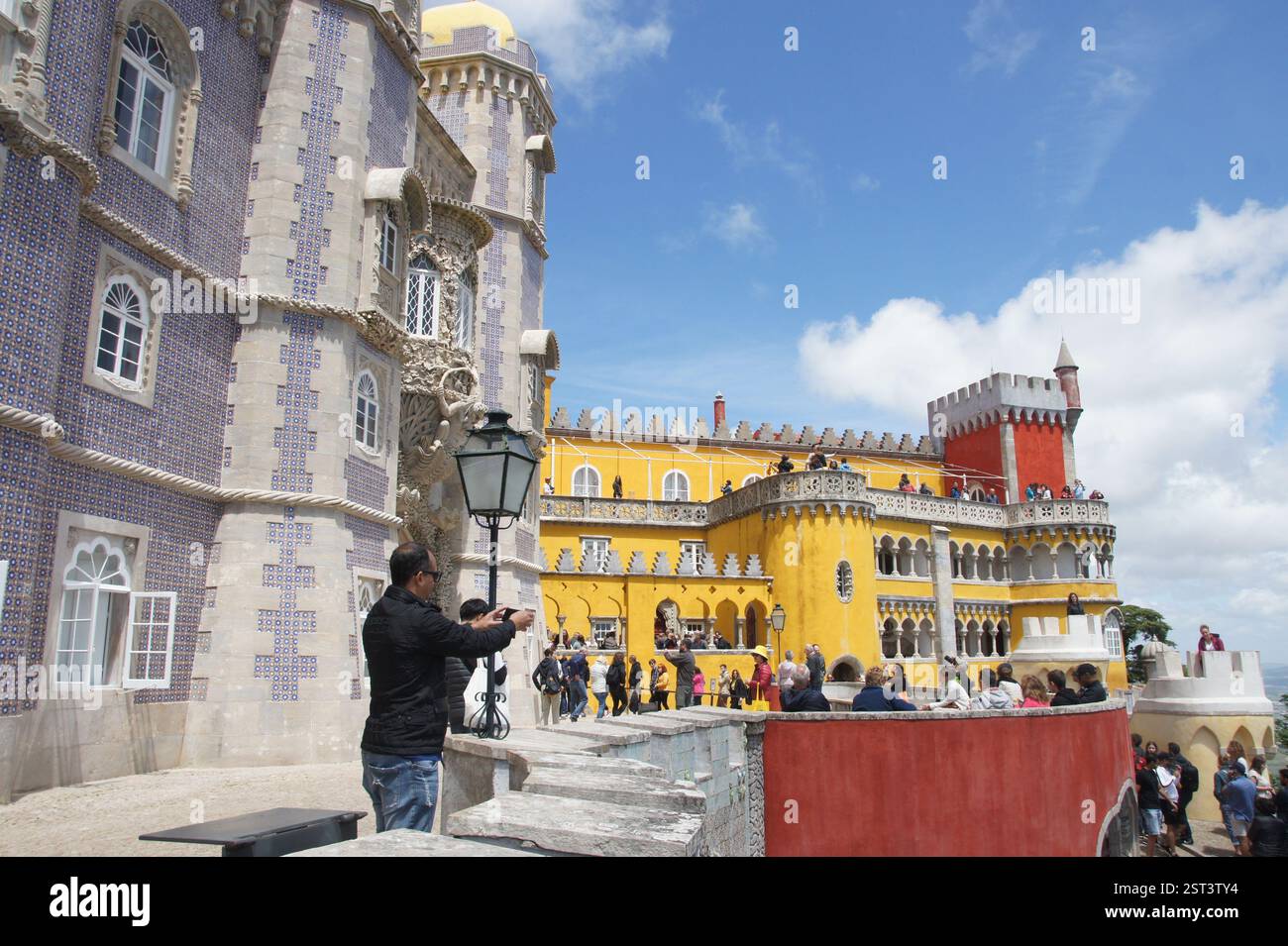 Sintra, Portugal. A majestic Pena Palace dominates the hilltop, its ...