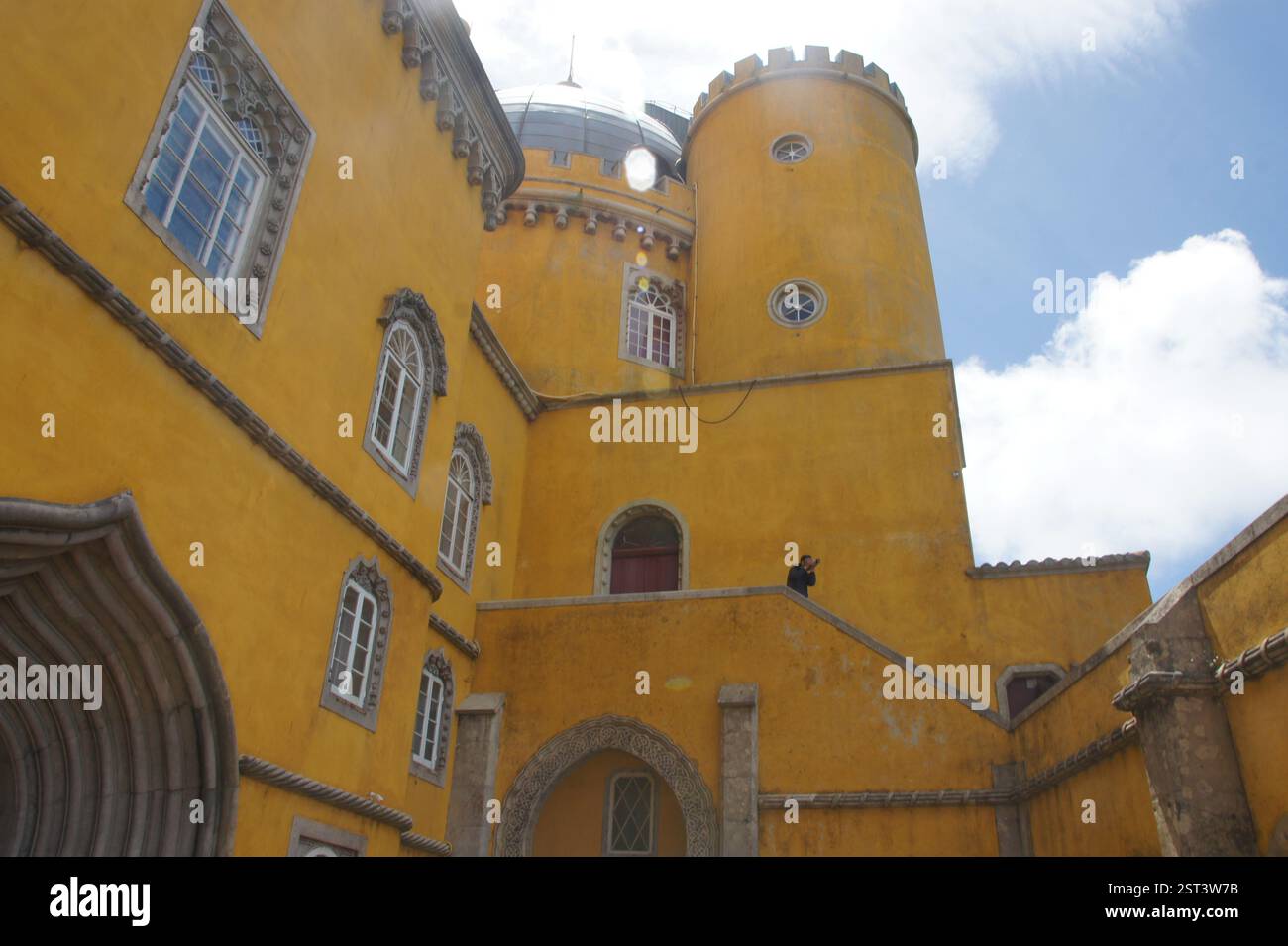 Pena Palace, Sintra, Portugal. A majestic architectural masterpiece boasting a vibrant yellow ...