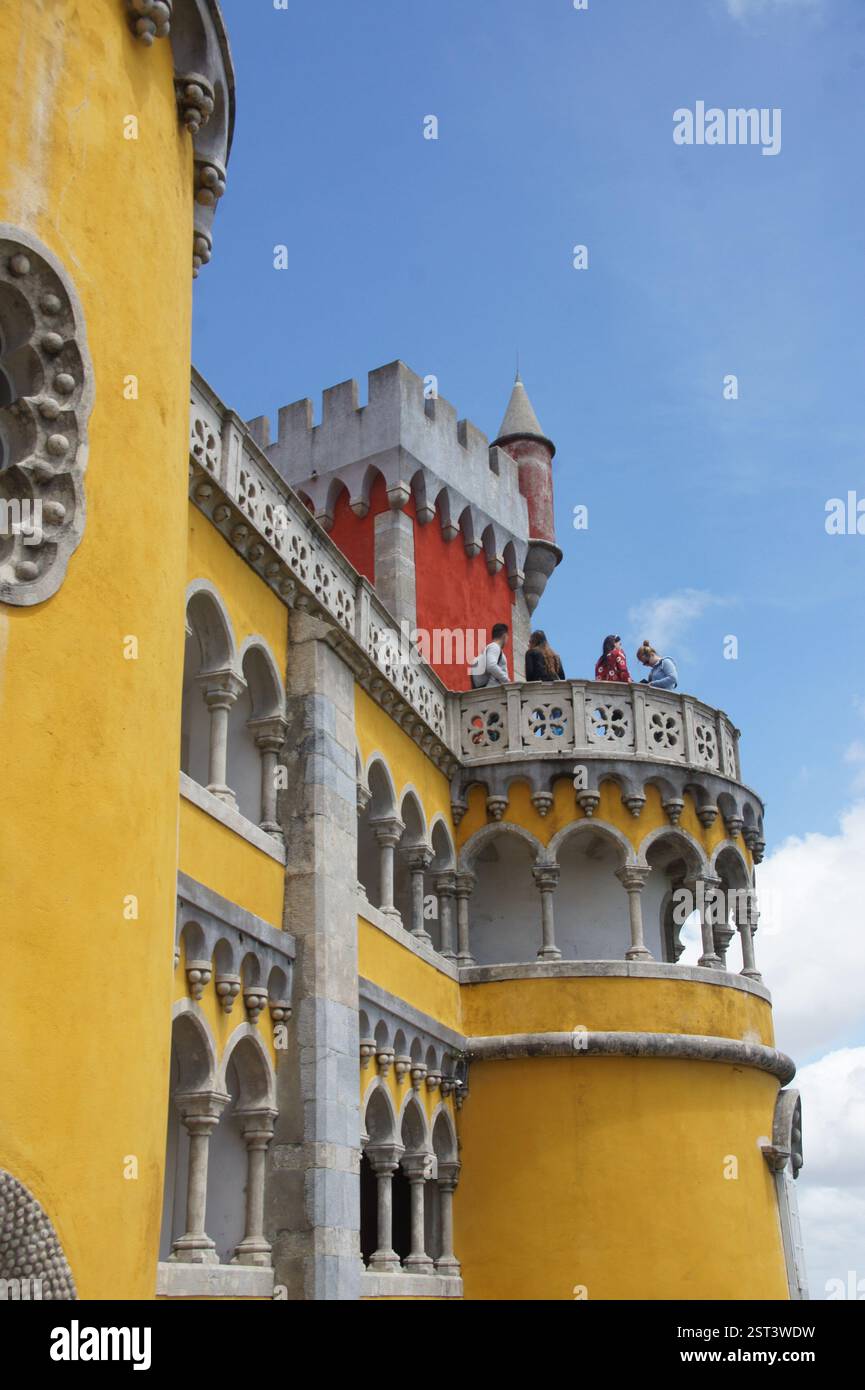 Pena Palace, Sintra. Vibrant yellow facade with red turrets ...