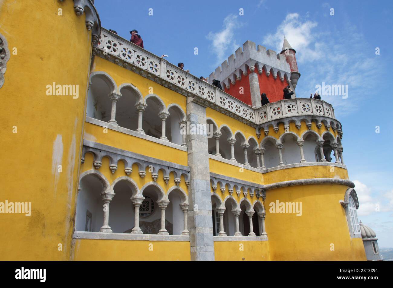 Pena Palace, Sintra. Vibrant yellow facade with red turrets ...