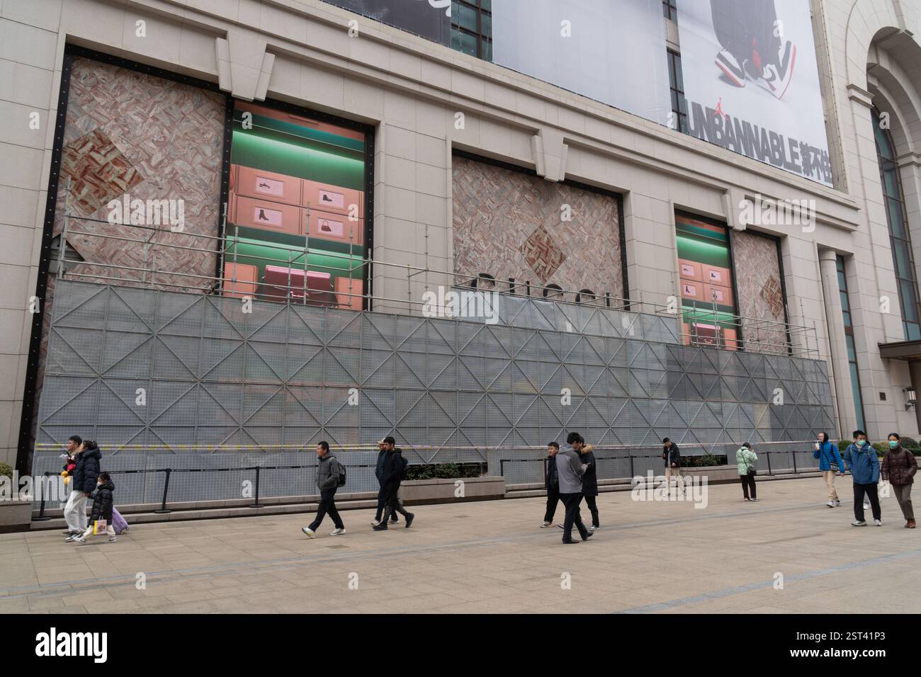 SHANGHAI, CHINA - FEBRUARY 17, 2025 - Citizens walk past a closed GUCCI ...