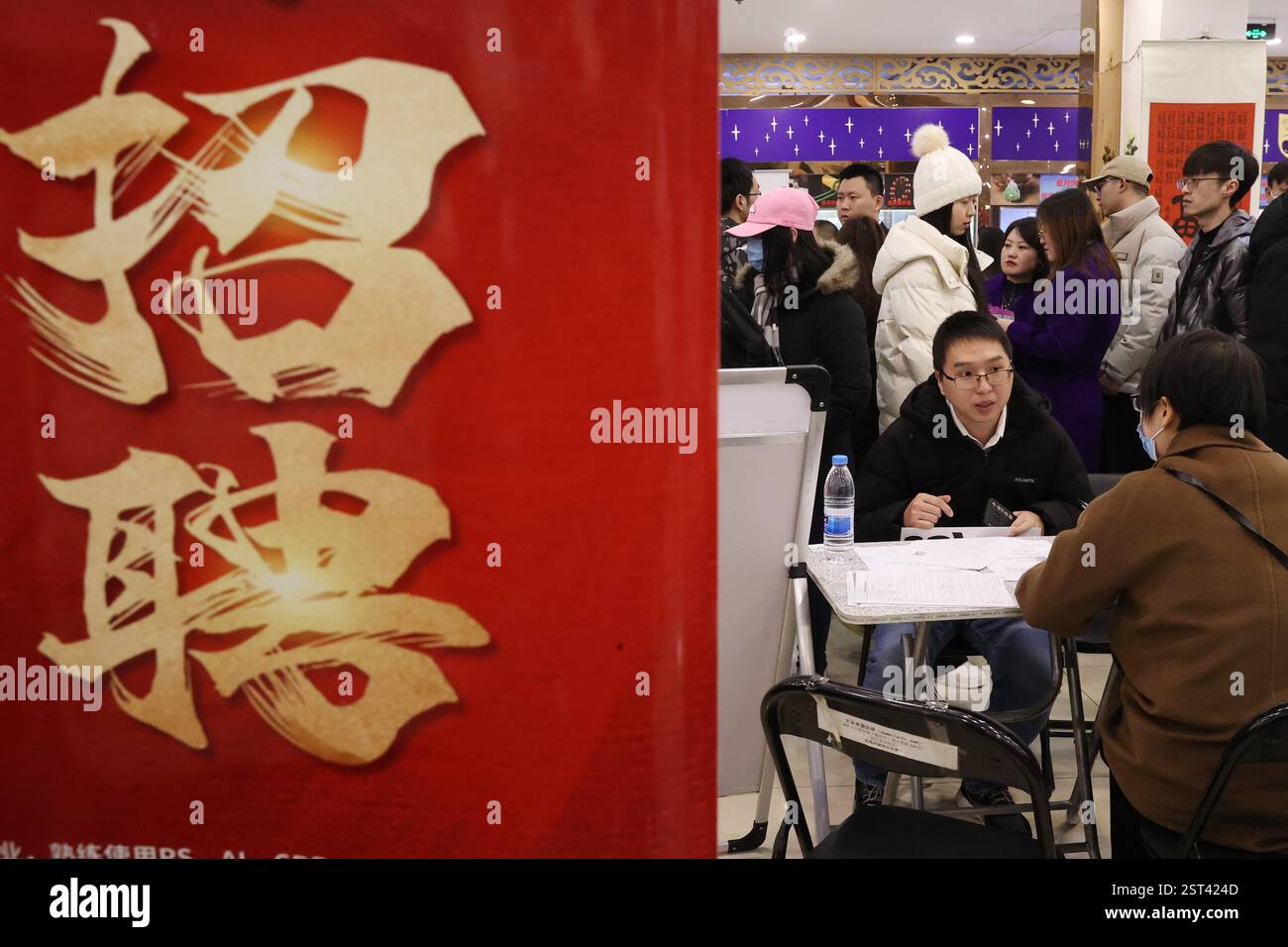 People look for jobs at a job fair in Beijing, China, 14 February, 2025 ...