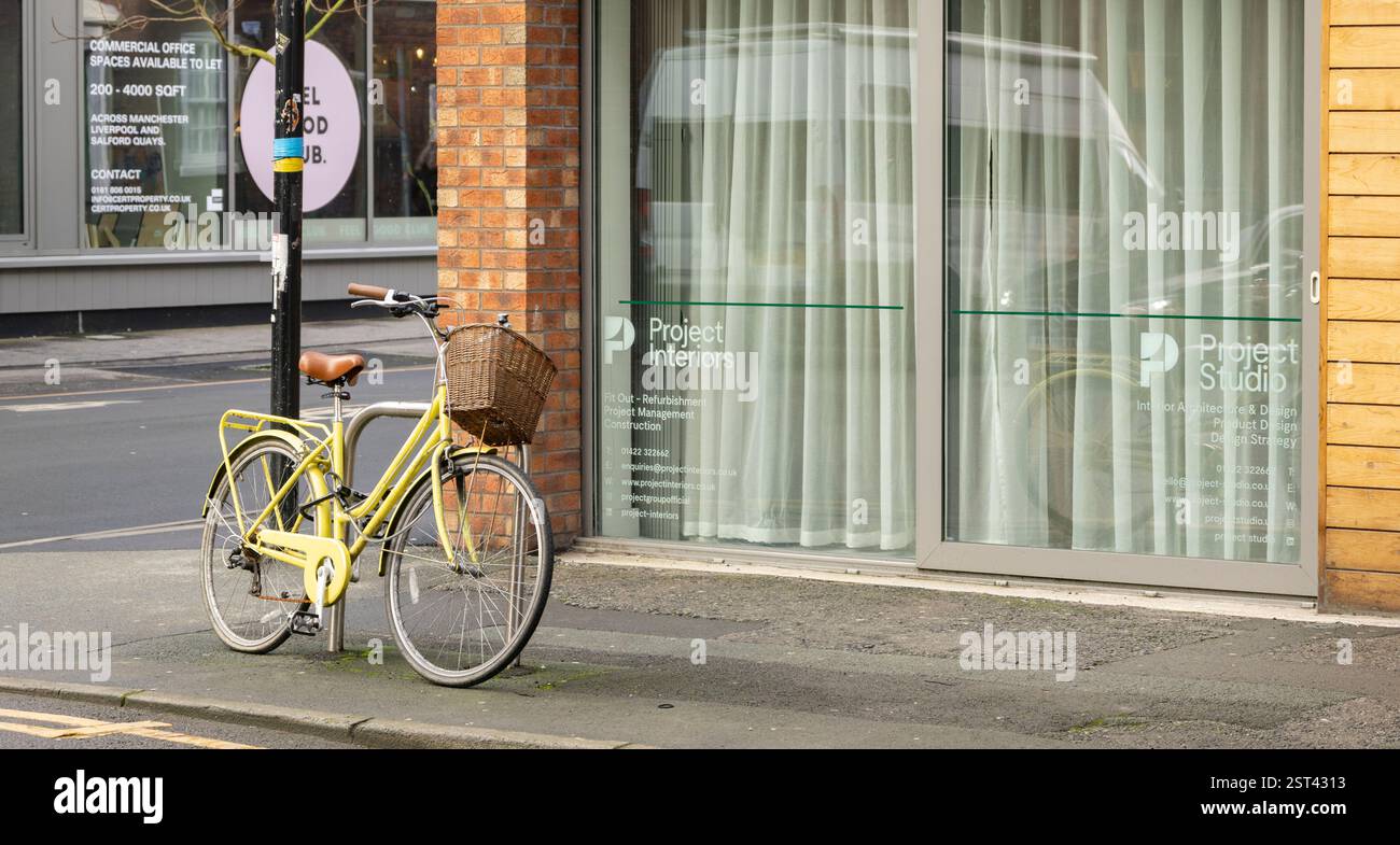 Manchester, uk, January 19th 2025 Old fashioned yellow bicycle standing ...