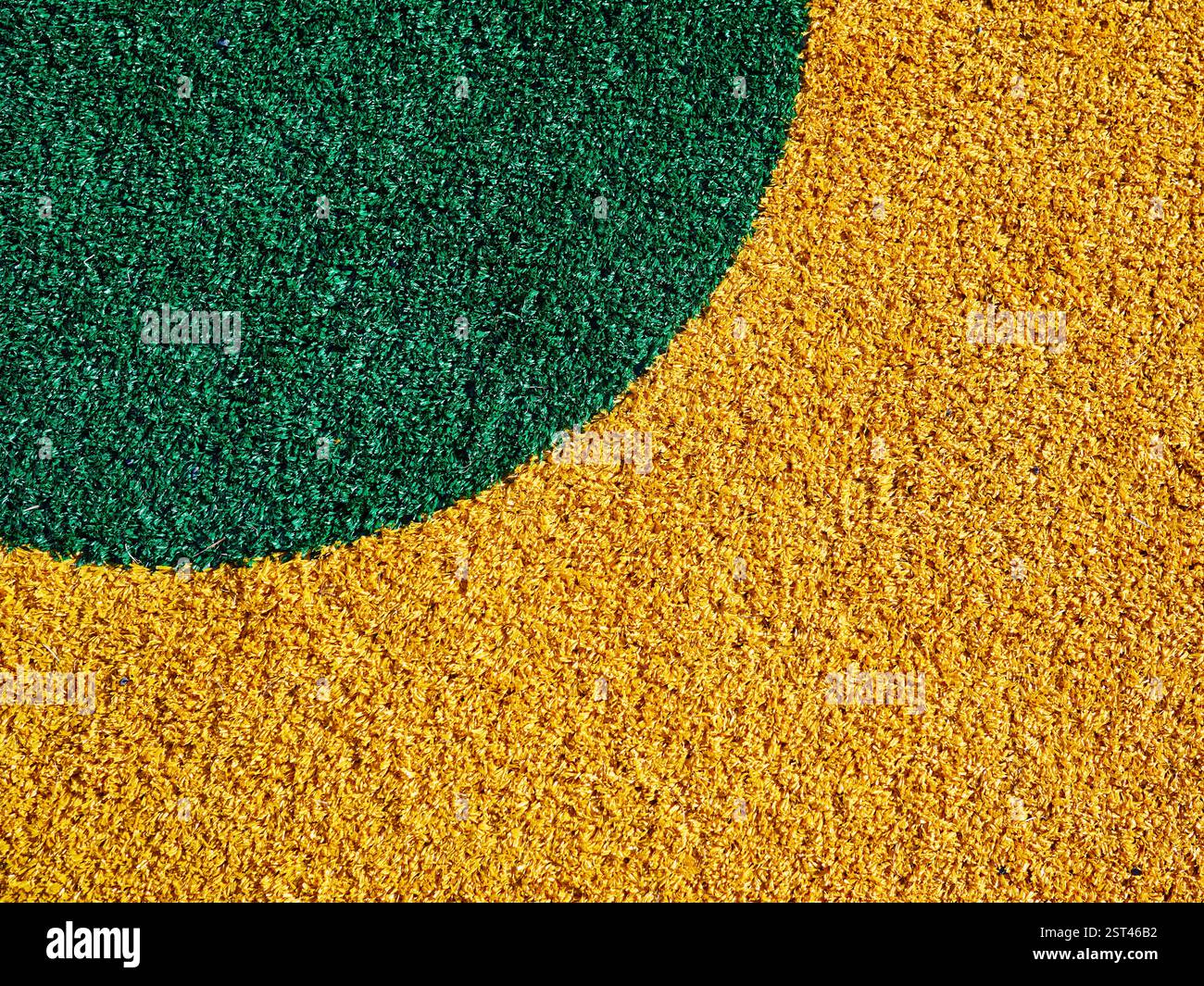 Vibrant green and gold artificial turf creating a dynamic pattern Stock ...