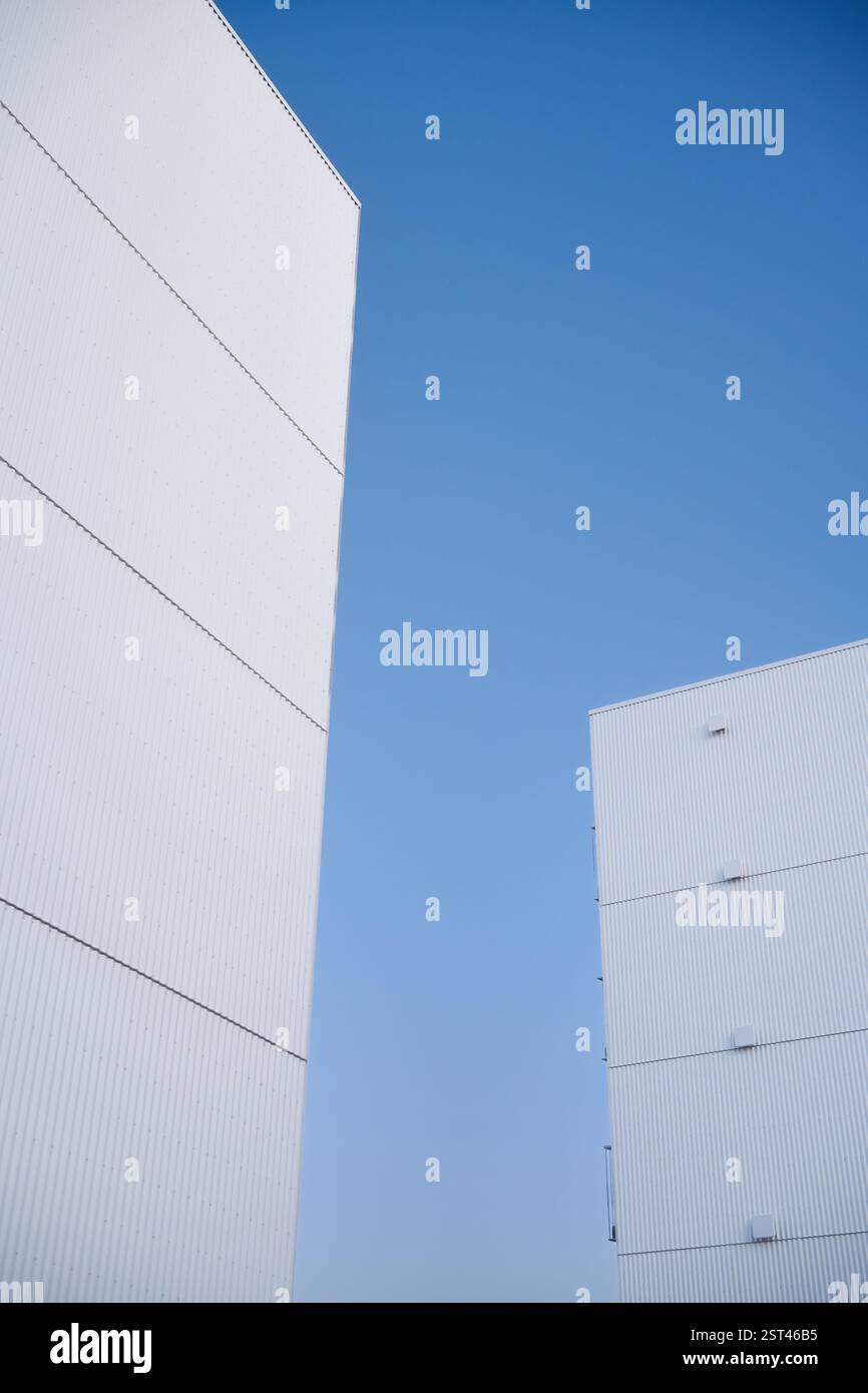 Modern white corrugated iron buildings reaching for the blue sky Stock ...