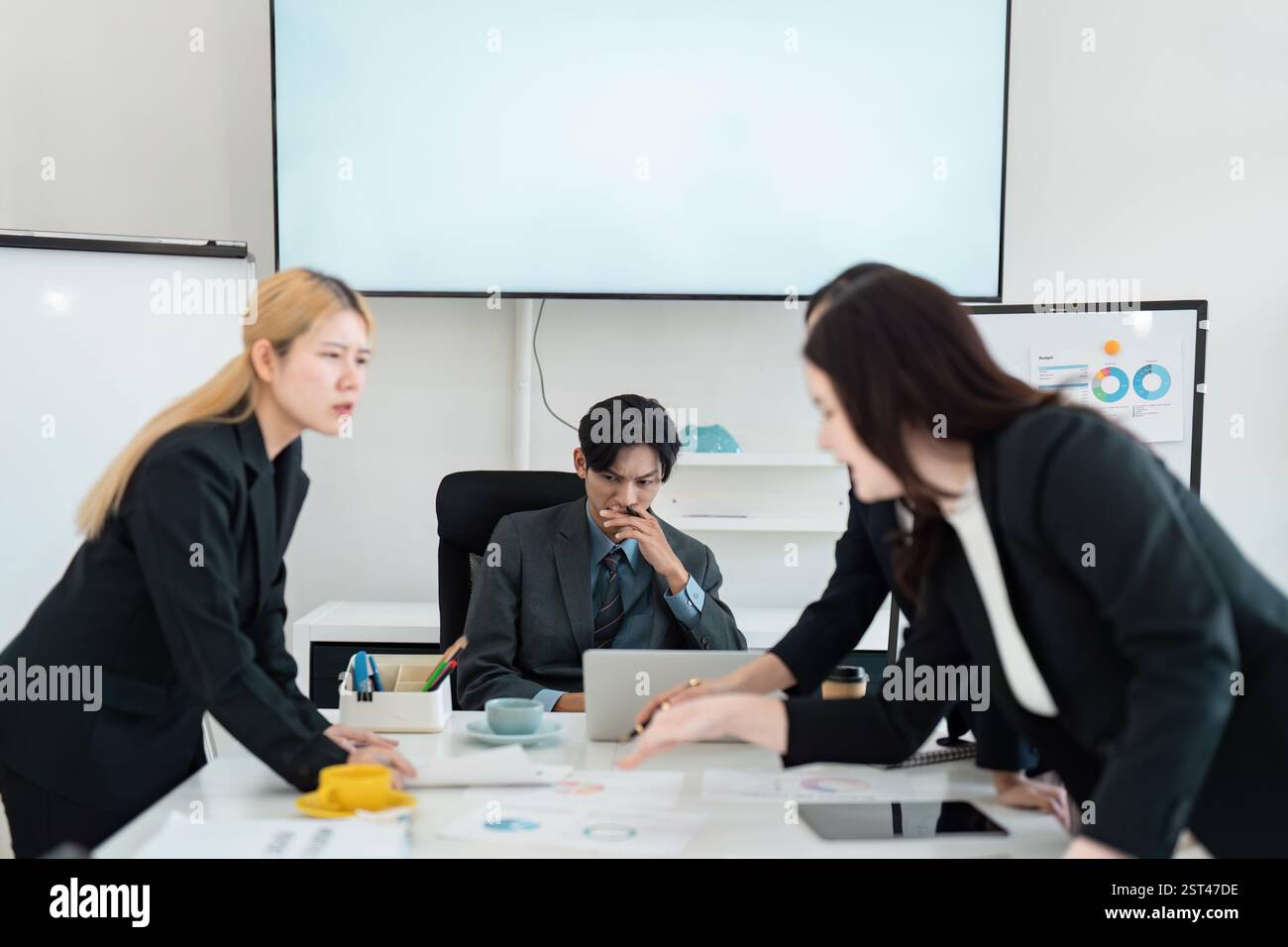 Multicultural business team analyzing data and discussing strategies ...