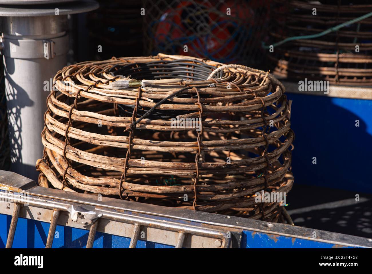 Lobster pot and fishing boat detail hi-res stock photography and images ...