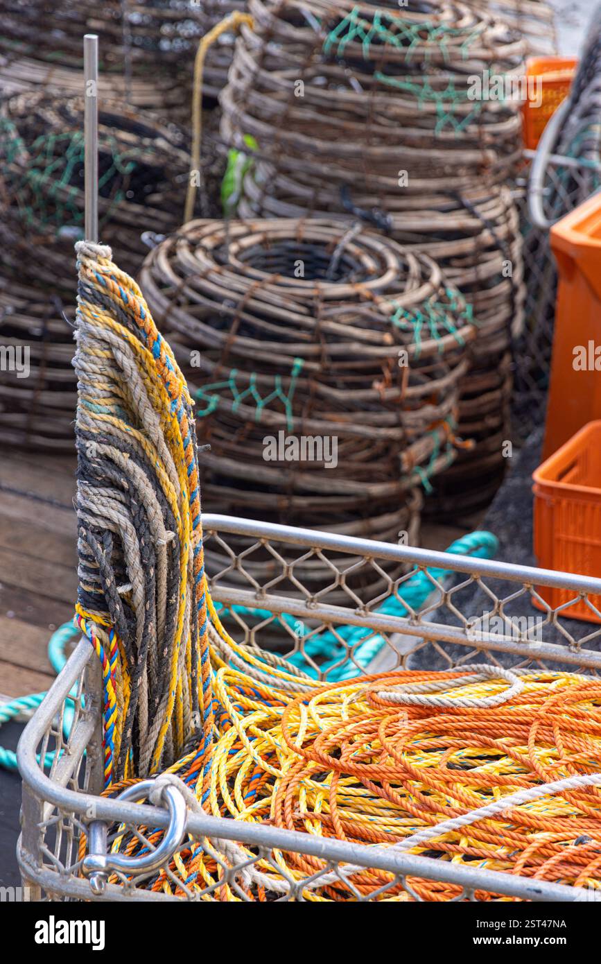 Close up coiled fishing ropes and stacked traps on fishing boat Stock ...