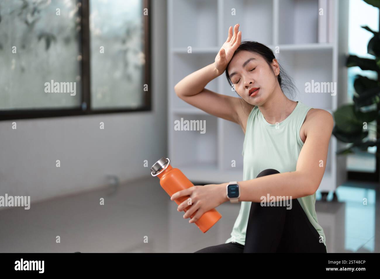 Tired after indoor workout routine hi-res stock photography and images ...
