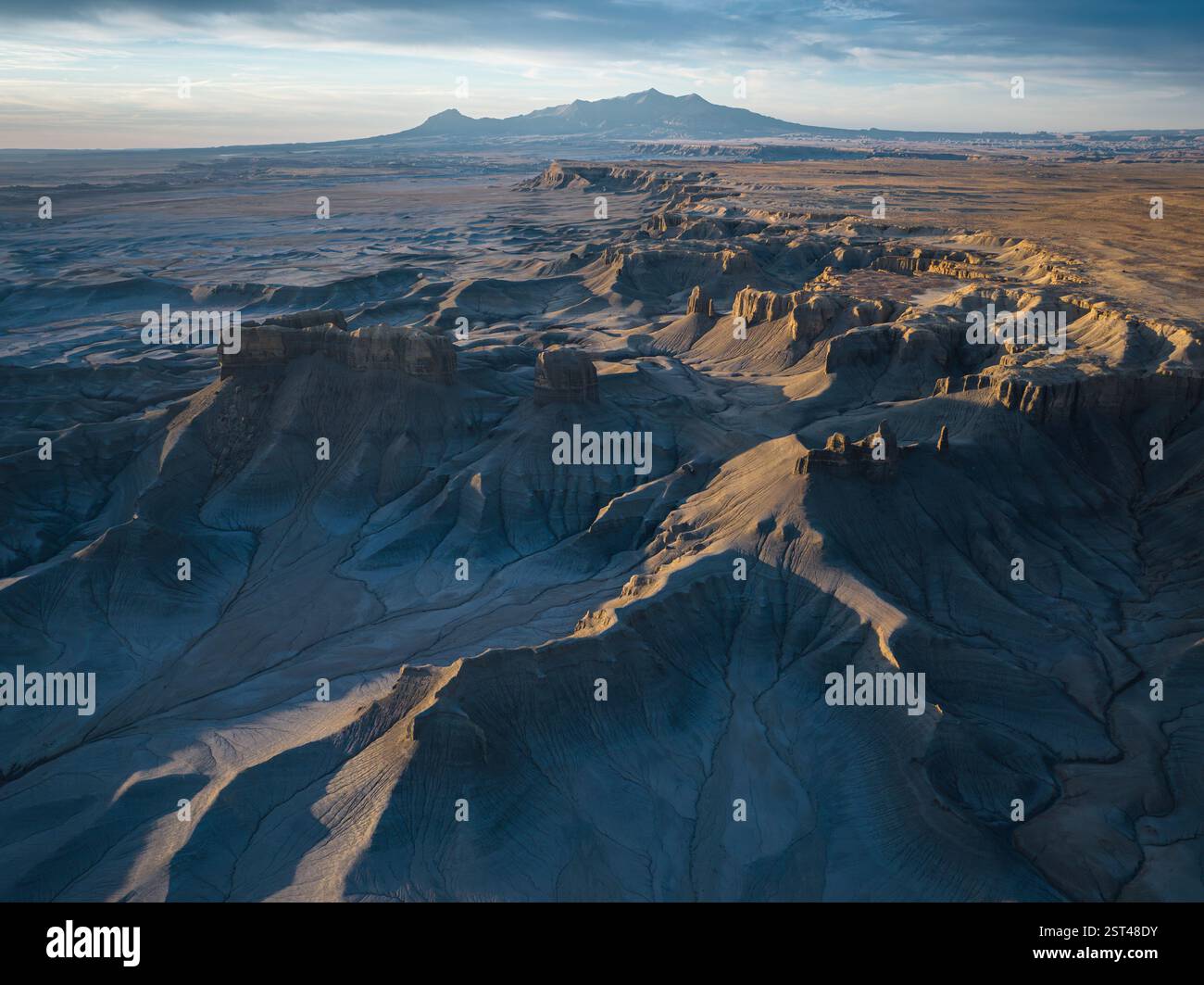 Aerial View of Rugged Desert Badlands with Dramatic Shadows Stock Photo ...