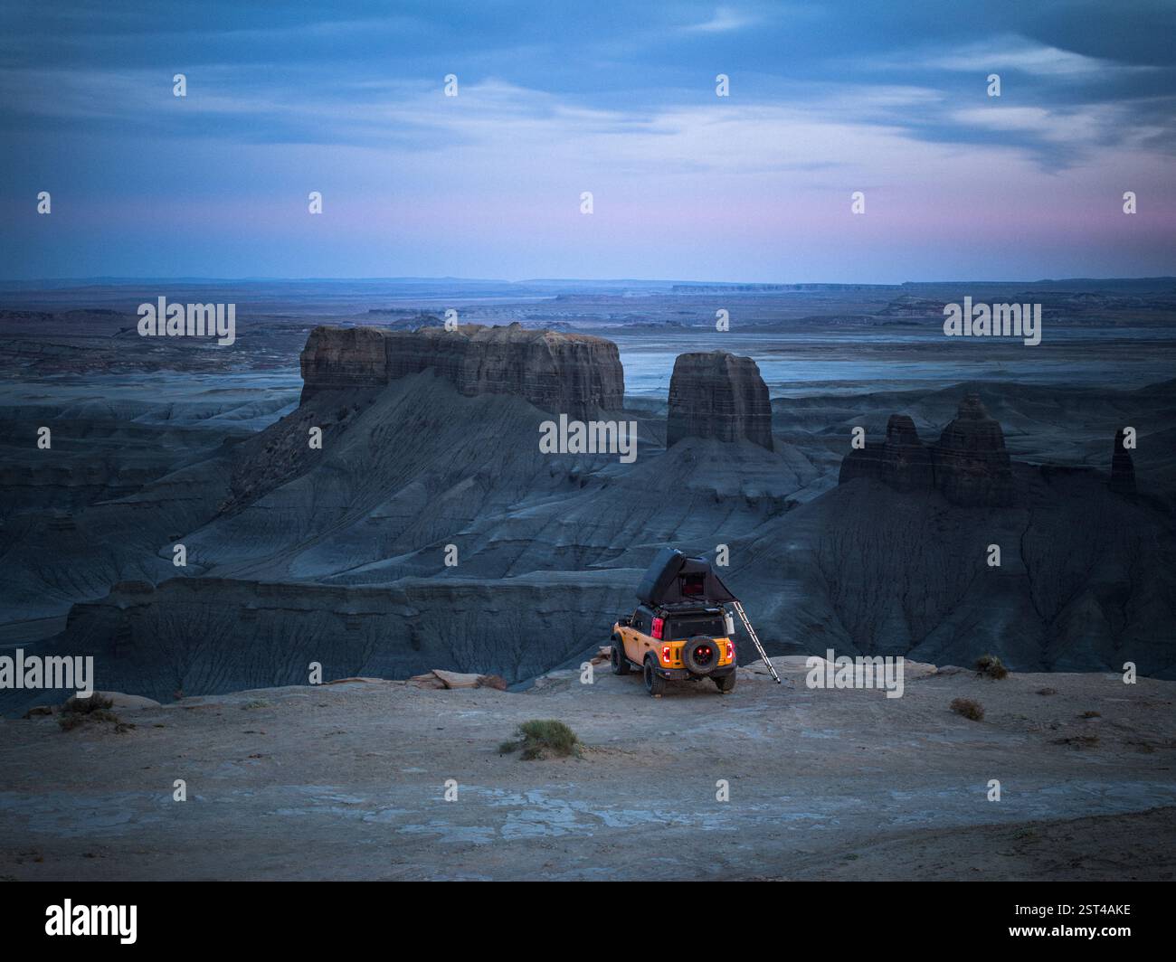 Yellow Truck Rooftop Tent Camping on a Cliff at Twilight Stock Photo ...