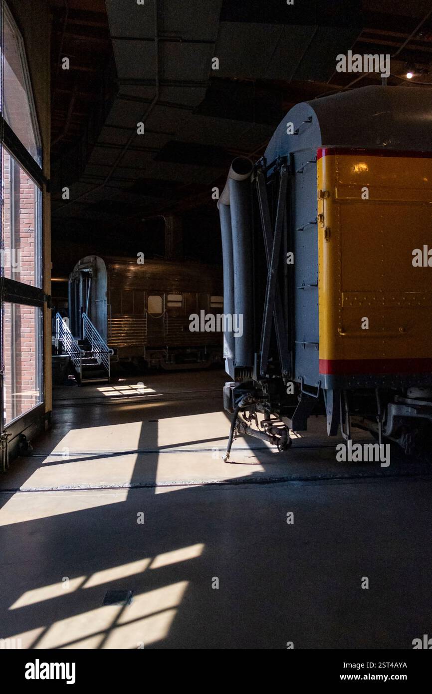 Passenger rail cars on display inside museum Stock Photo - Alamy