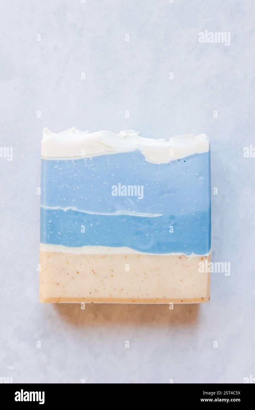 Coastal-themed soap bar with blue ocean waves and sandy layers Stock ...