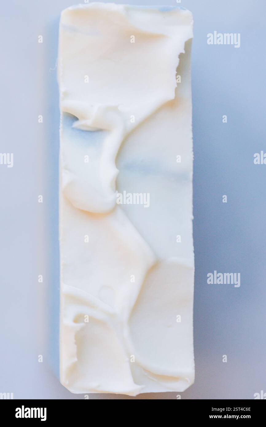 White handcrafted soap bar with a smooth, textured surface Stock Photo ...