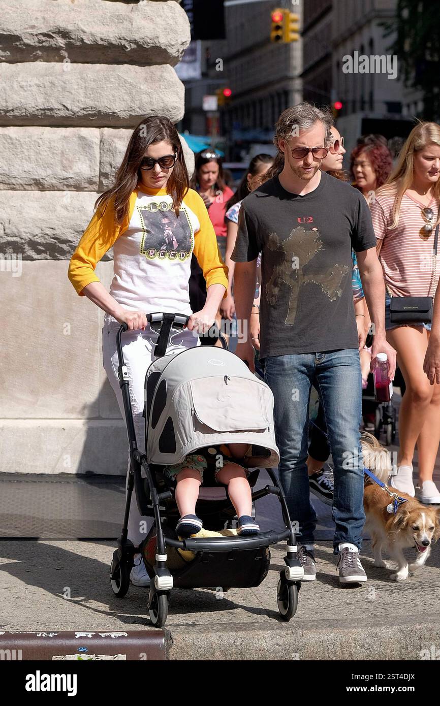 Actress Anne Hathaway walks in Soho with her husband Adam Shulman and ...