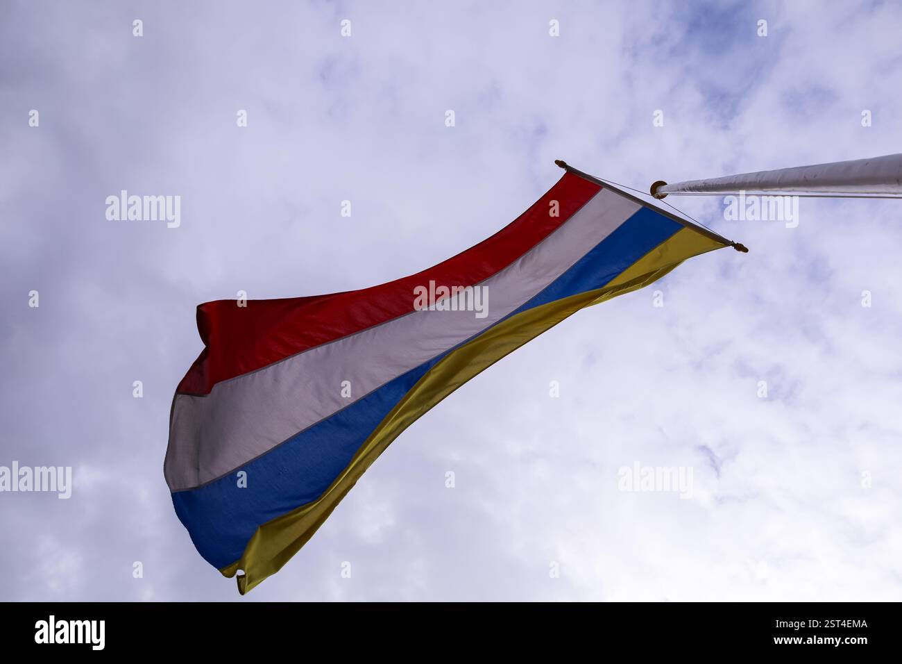 The flag of the German carnival against the blue sky in Mainz Stock ...