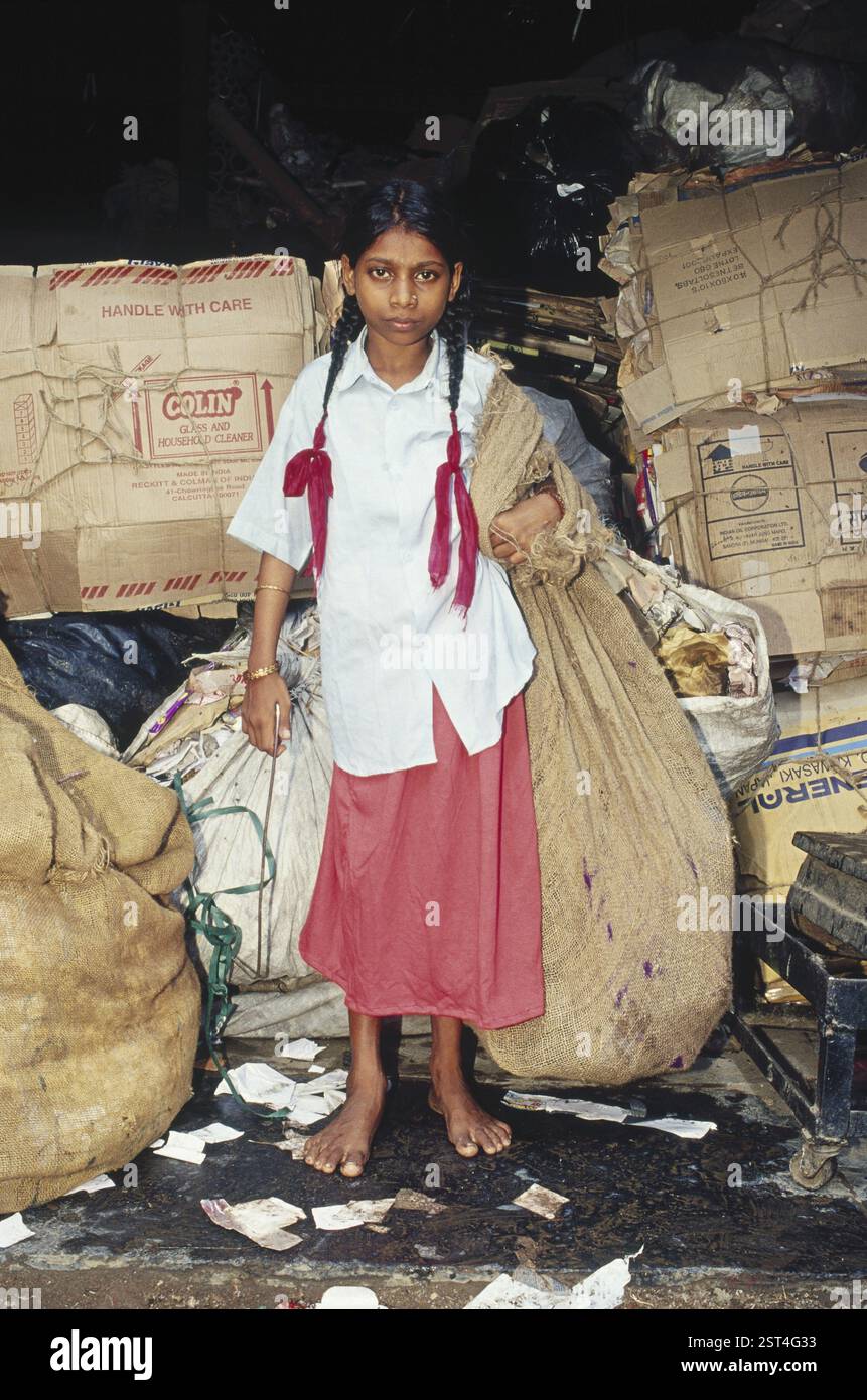 Rag picker girl standing at paper shop Stock Photo - Alamy