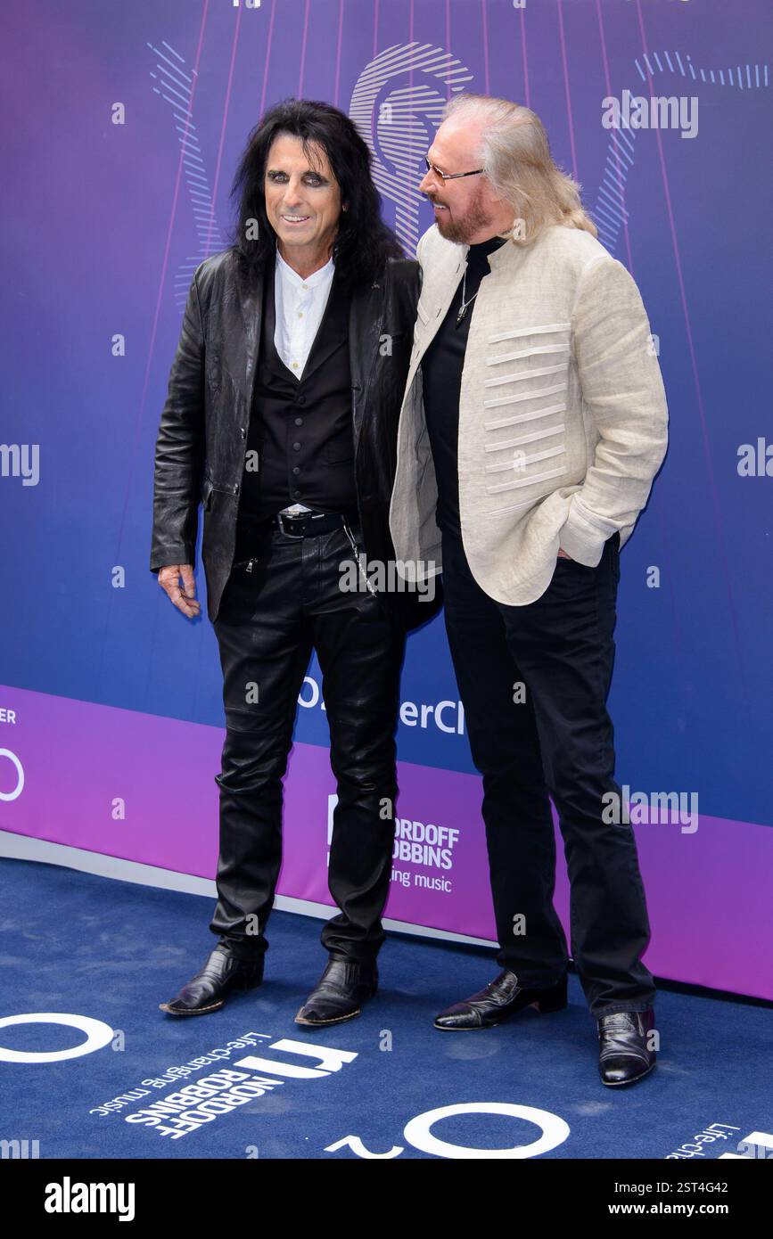 Alice Cooper and Barry Gibb attends Nordoff Robbins O2 Silver Clef ...