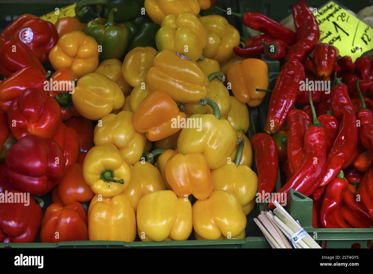 Red and yellow peppers and chillies at a vegetable stall, Bavaria ...