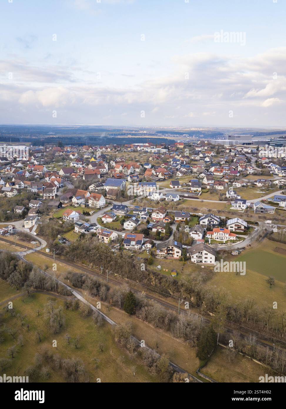 Settlement with various buildings and winter landscape from the air ...