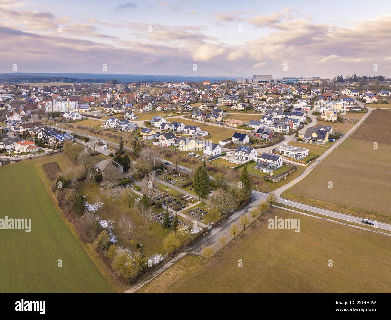 Suburban housing estate in a rural setting with open green spaces and a ...