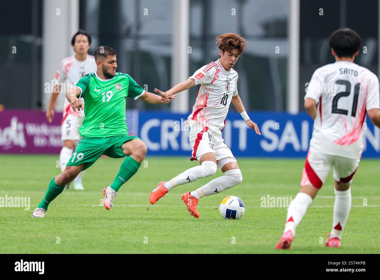 Shenzhen. 17th Feb, 2025. Ozeki Yuto (C) of Japan controls the ball during a Group D match ...