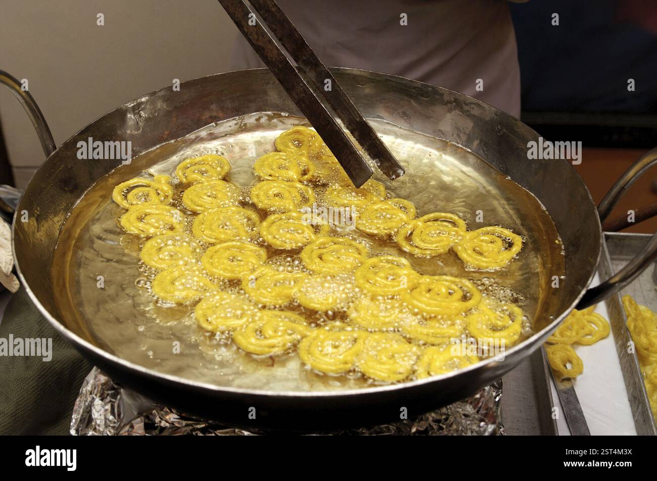 Indian sweet dish jalebi made by frying lentil dough and dipping in ...