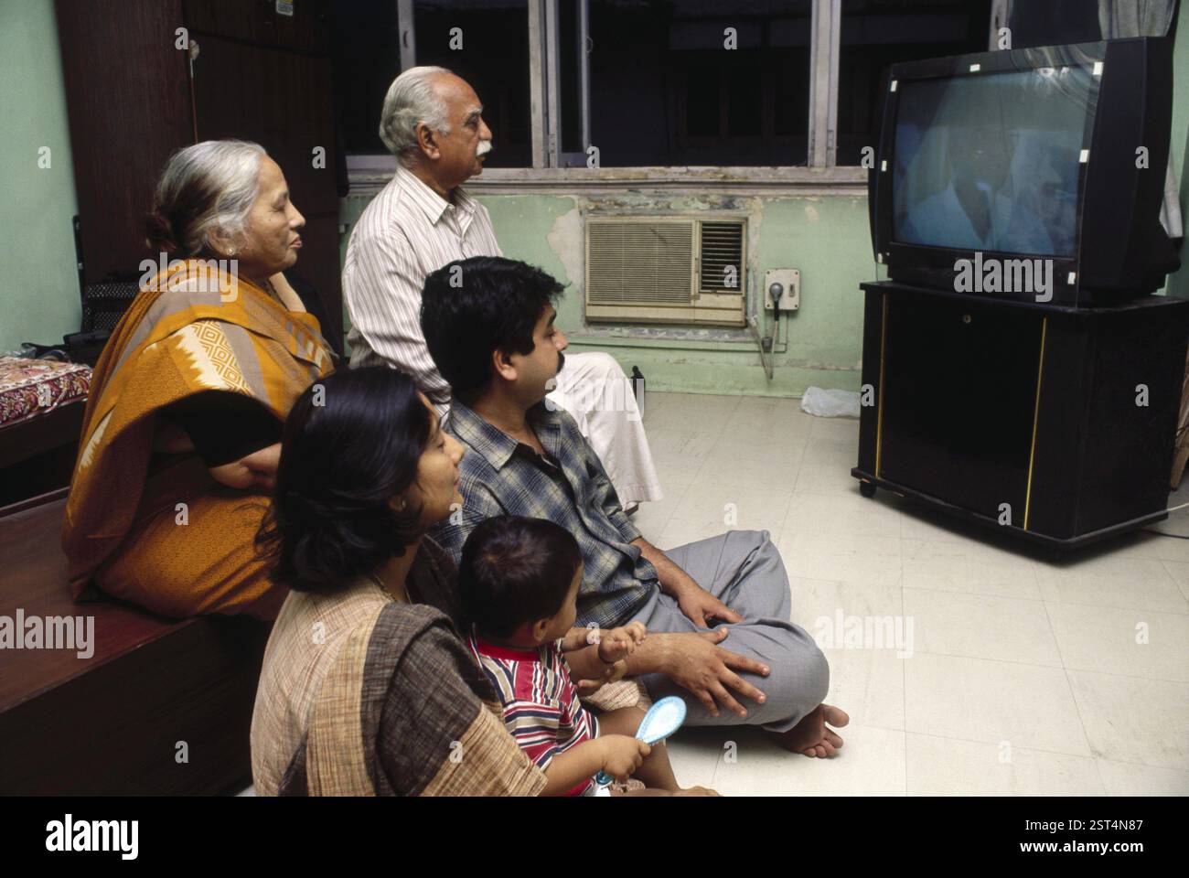Indian Family Watching Tv Indian Family Watching Tv Stock Photos