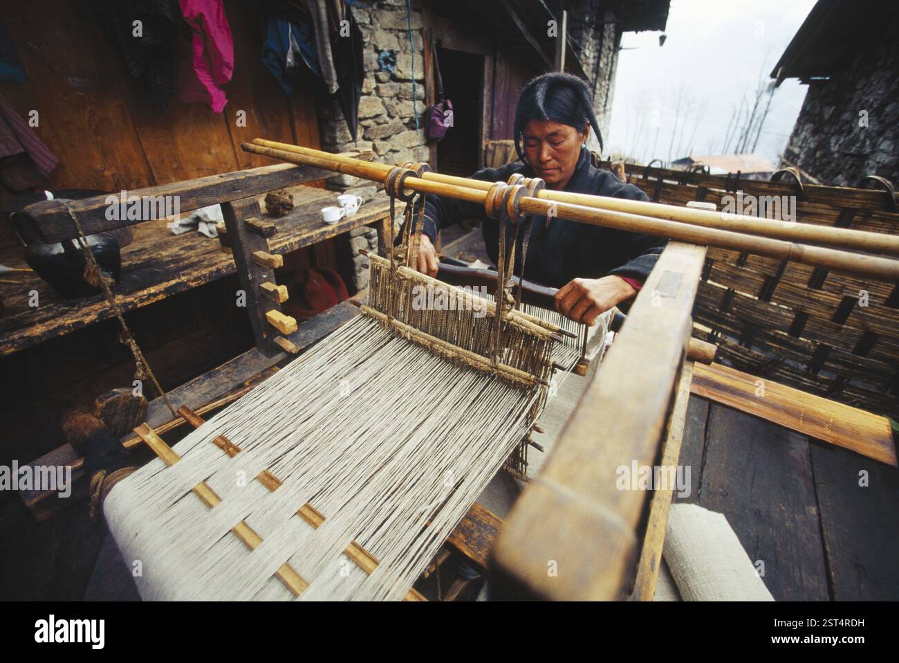 Mompha Tribe woman weaving on Handloom, Tawang, arunachal pradesh ...